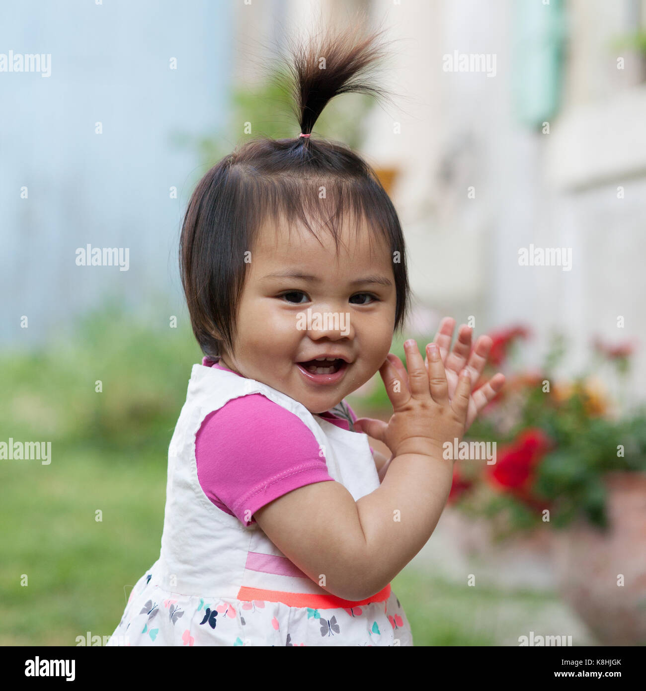 Baby girl clapping hands hi-res stock photography and images - Alamy