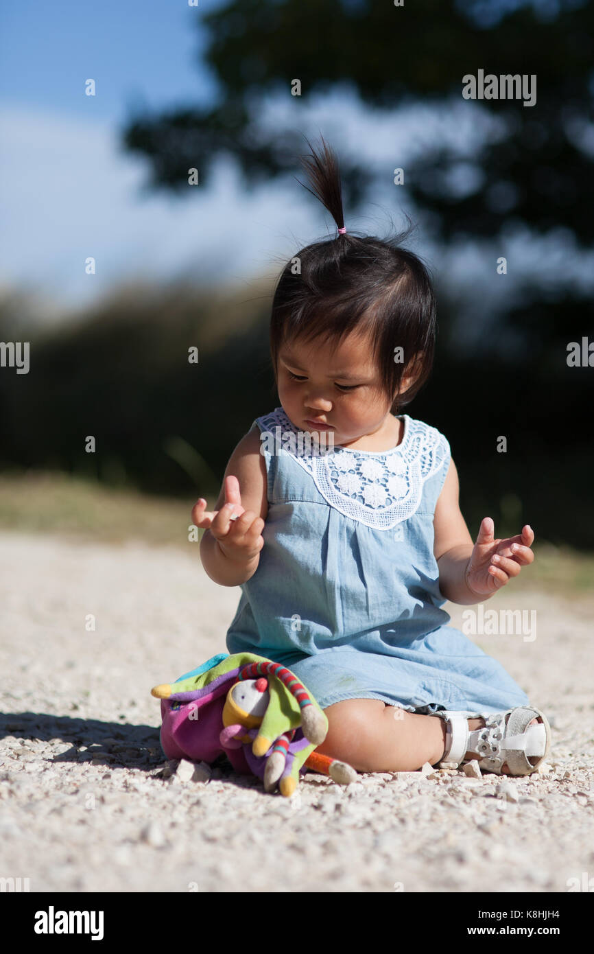 Girl playing the rocks hi-res stock photography and images - Alamy