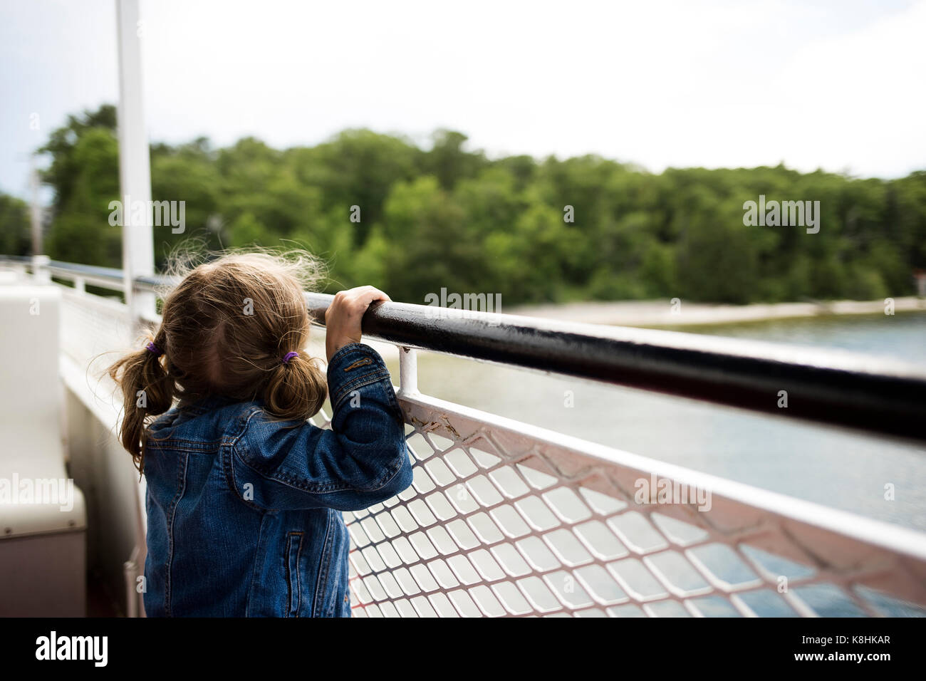 Girl at the railing hi-res stock photography and images - Alamy