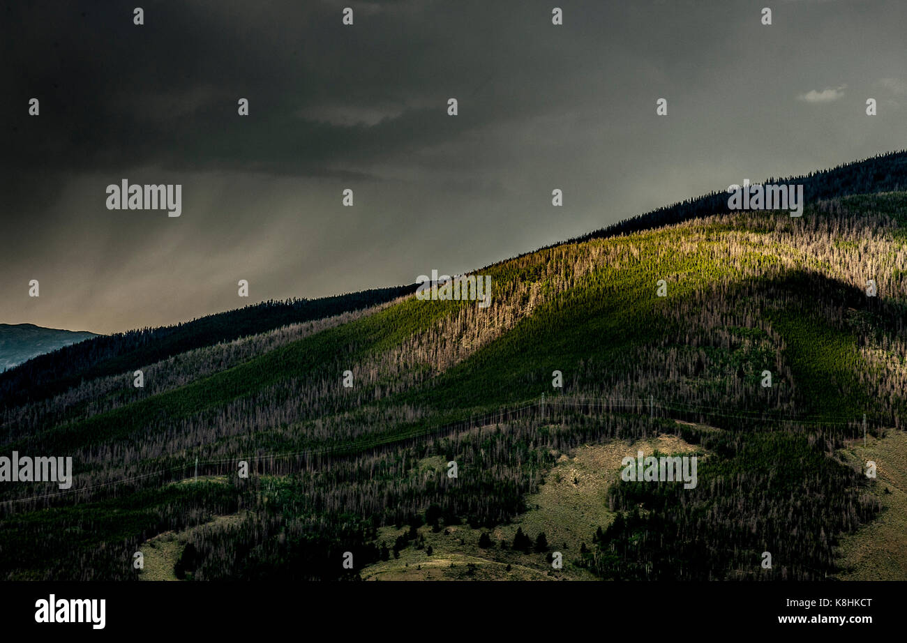 Idyllic view of landscape against stormy clouds Stock Photo - Alamy