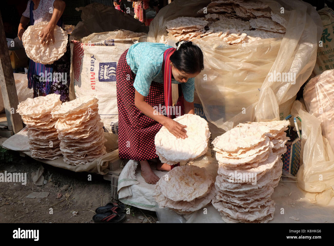 Burma, Myanmar: woman selling rice cakes at NamPan Market, Inle Lake ...