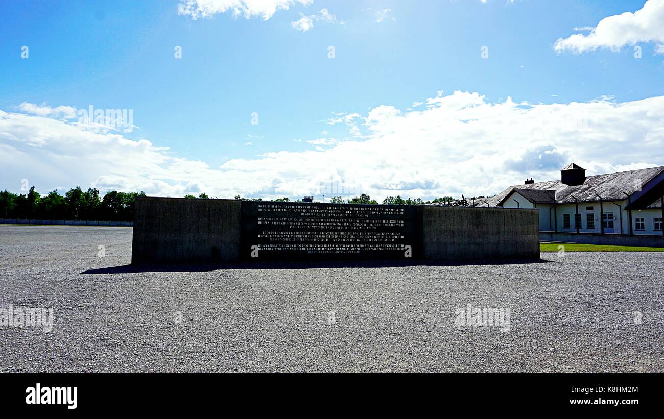 A memorial wall "Never again" written in several languages in Dachau ...