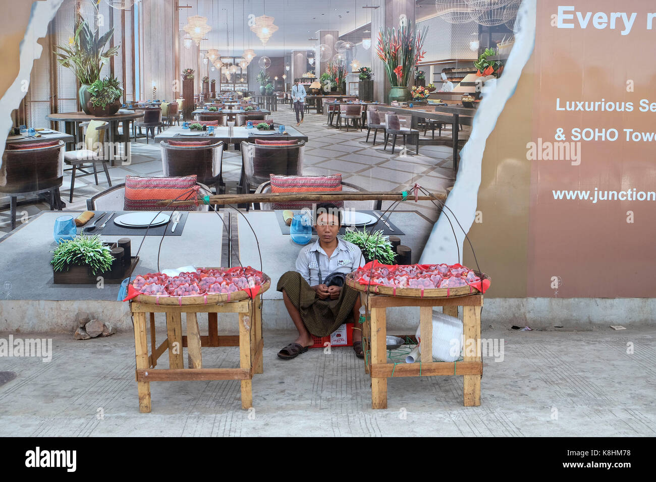 Burma, Myanmar: fruit peddler and poster in a street of Rangoon, the ...