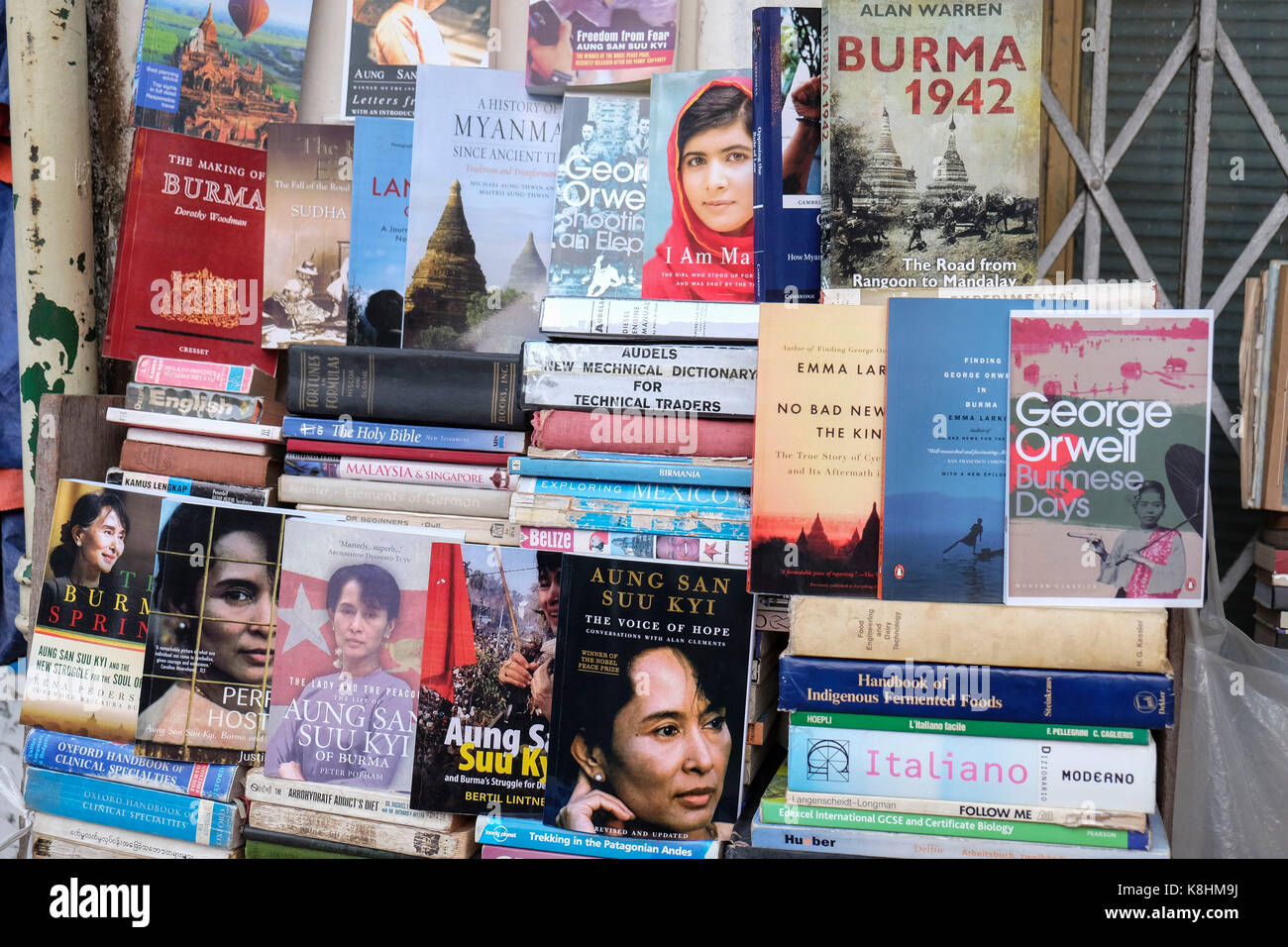 Burma, Myanmar: books of a street bookseller in Rangoon. Cover of books ...