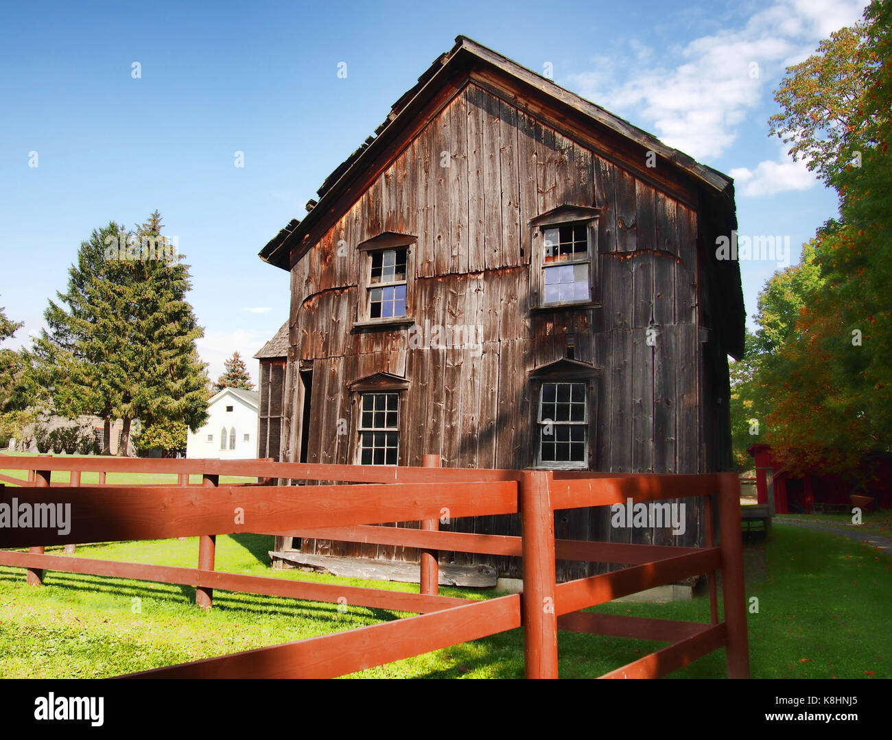 old barn with red fence Stock Photo - Alamy