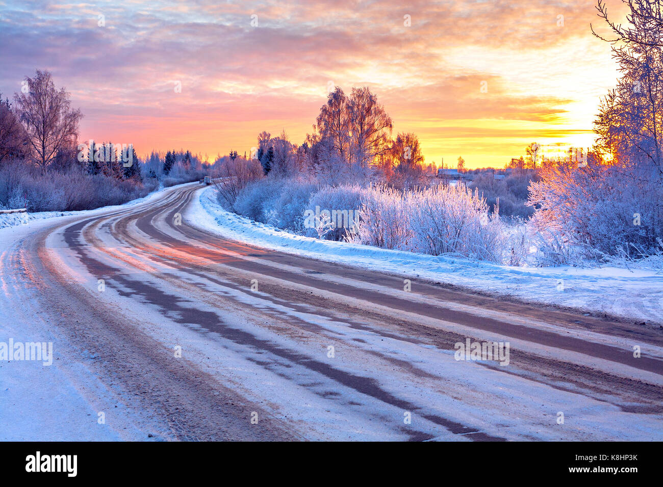 winter landscape with sunset,road and forest. path winter covered with ...