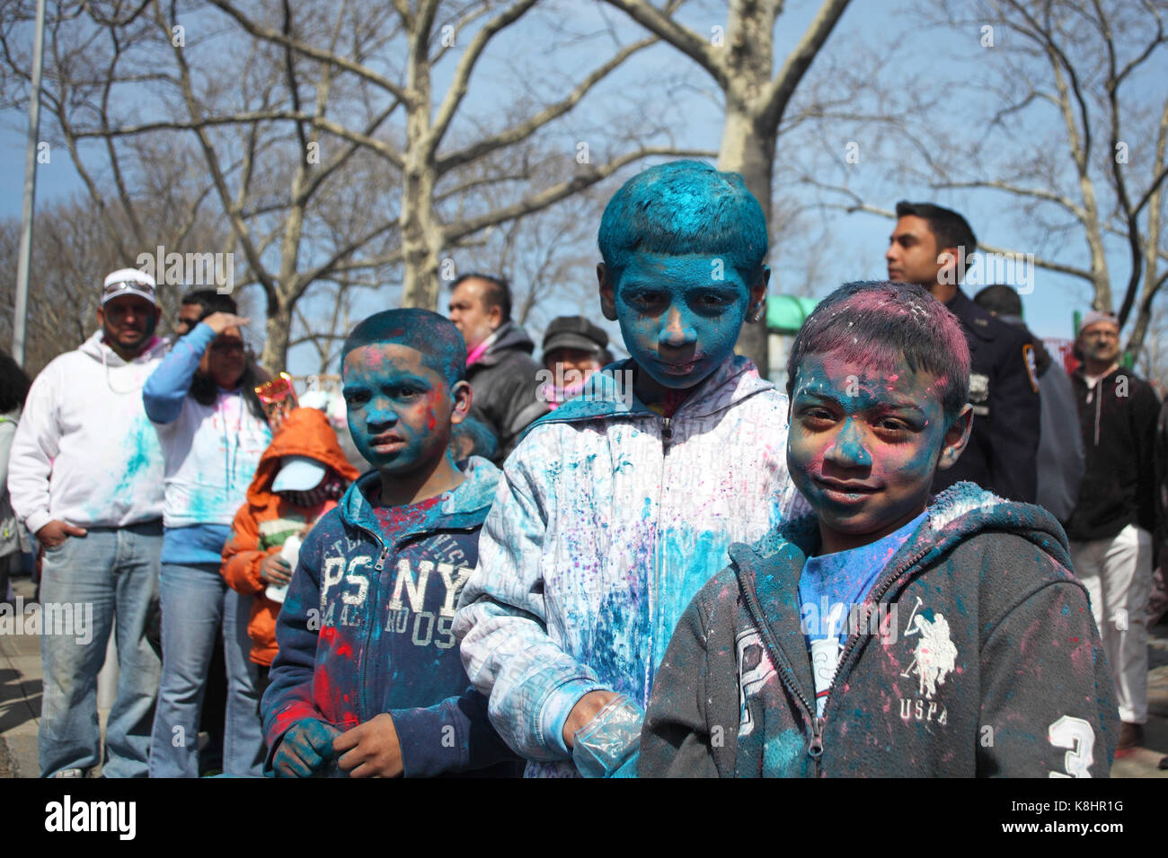 Powder-covered revelers attend the Phagwah Parade celebrating Holi in ...