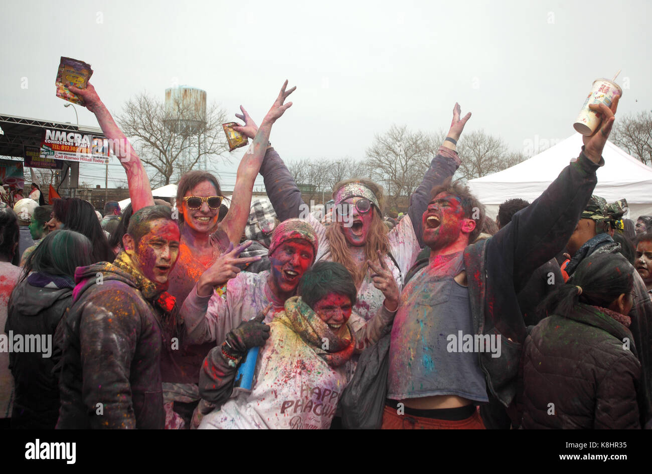 Powder-covered revelers attend the Phagwah Parade celebrating Holi in ...