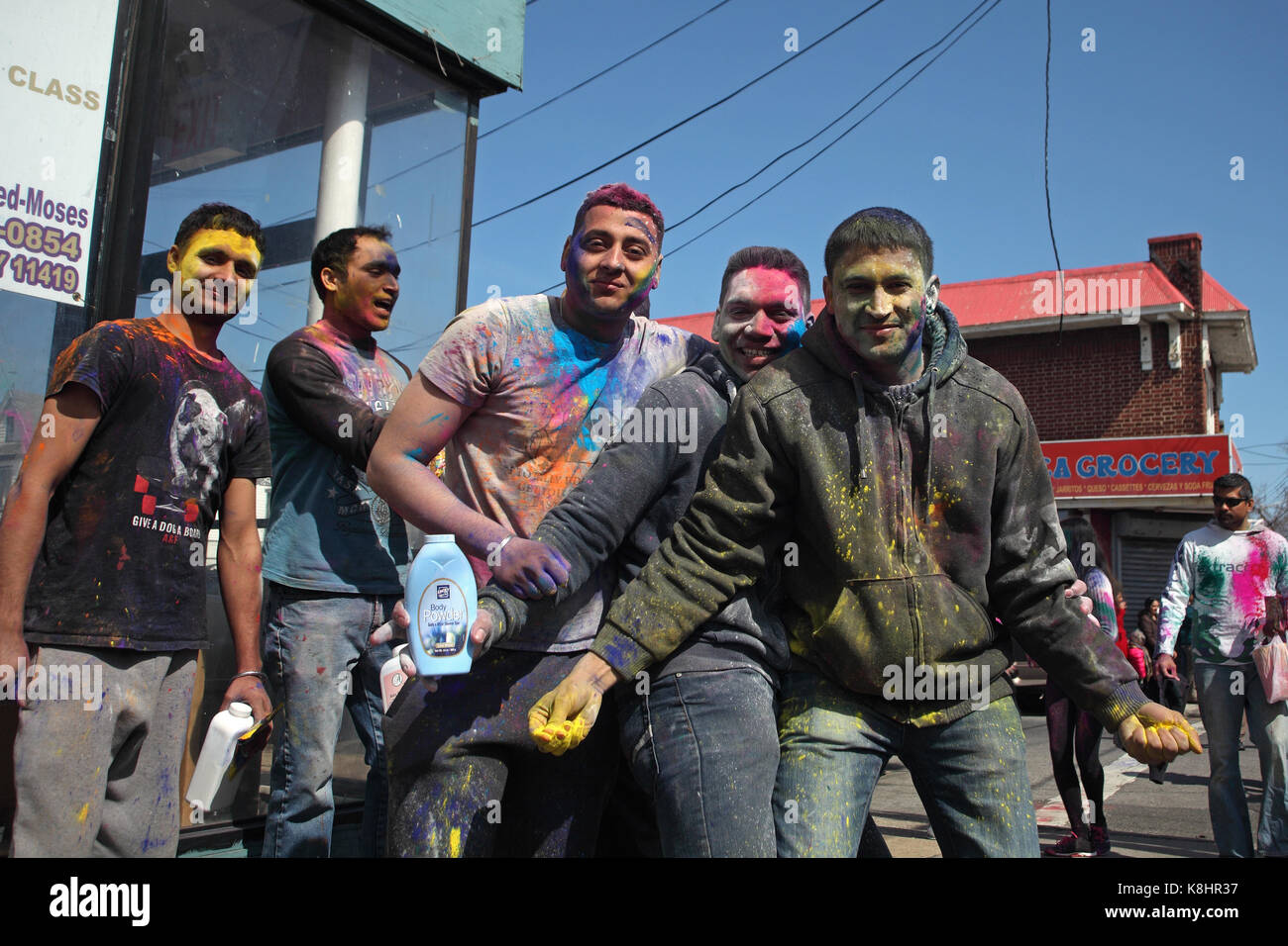 Powder-covered revelers attend the Phagwah Parade celebrating Holi in ...