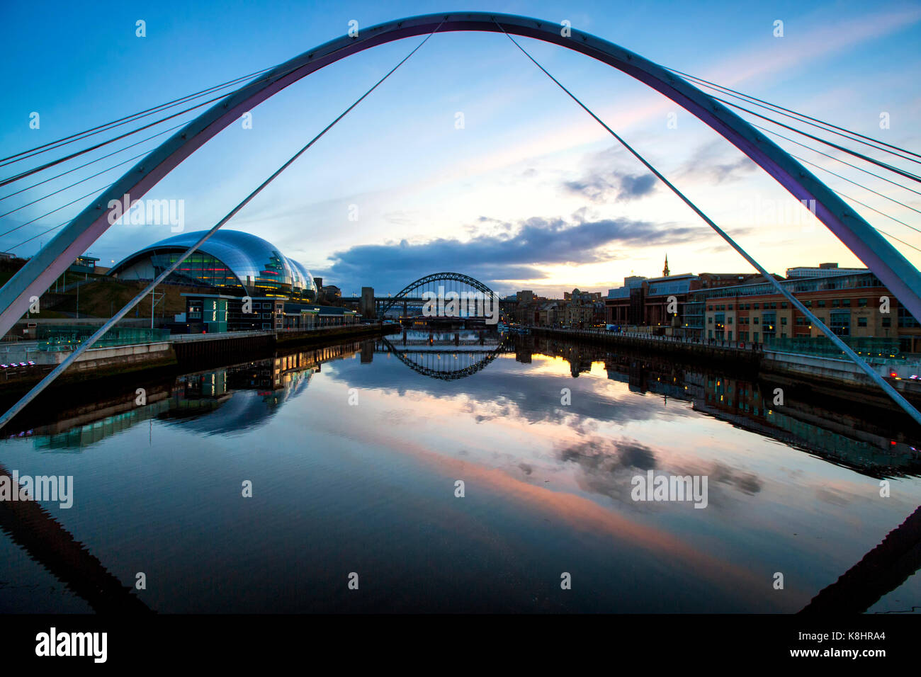 Gateshead Millennium Bridge over river against sky Stock Photo - Alamy