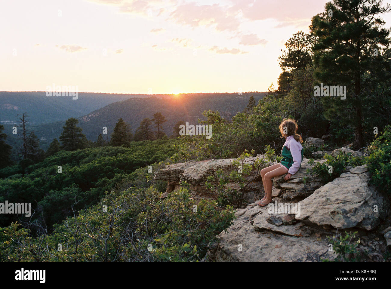 Girl sitting watching the sunset hi-res stock photography and images ...