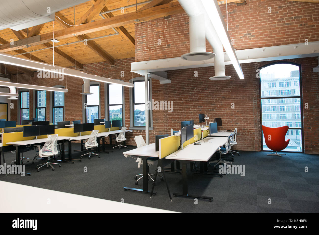 Trendy modern open concept loft office space with big windows, natural ...