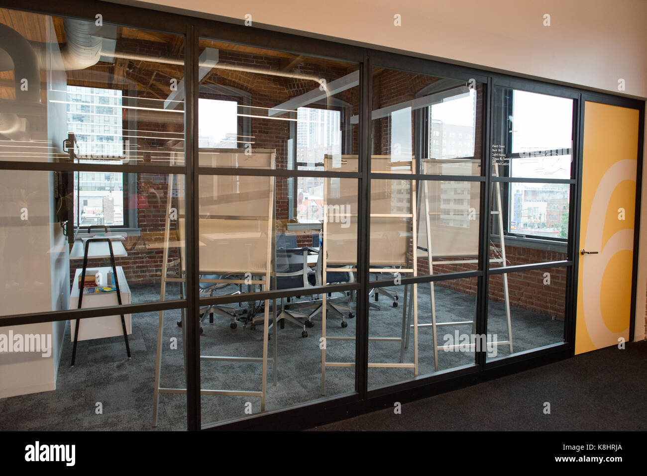 Trendy modern open concept loft office space with big windows, natural ...