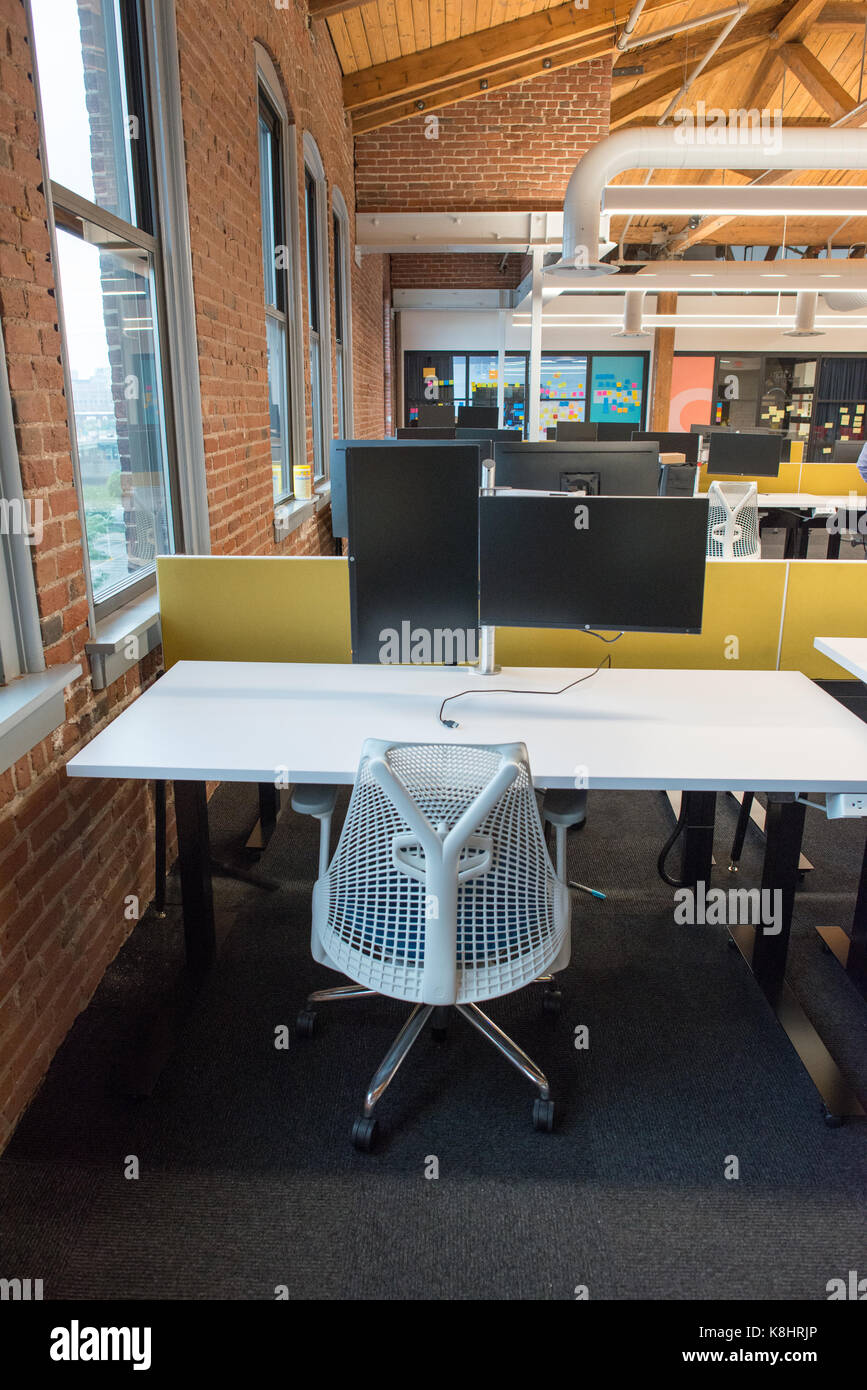 Trendy modern open concept loft office space with big windows, natural light and a layout to ...