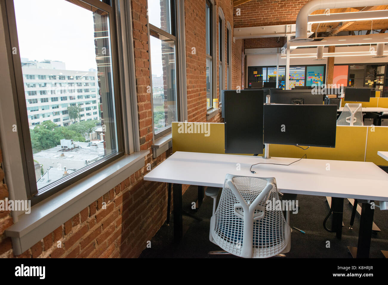 Trendy modern open concept loft office space with big windows, natural ...
