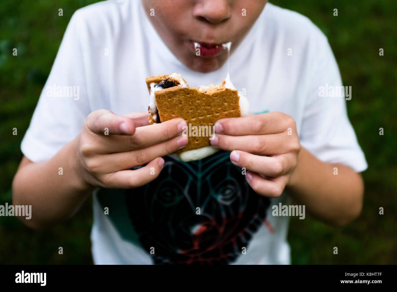 Boy eating unhealthy food hi-res stock photography and images - Alamy