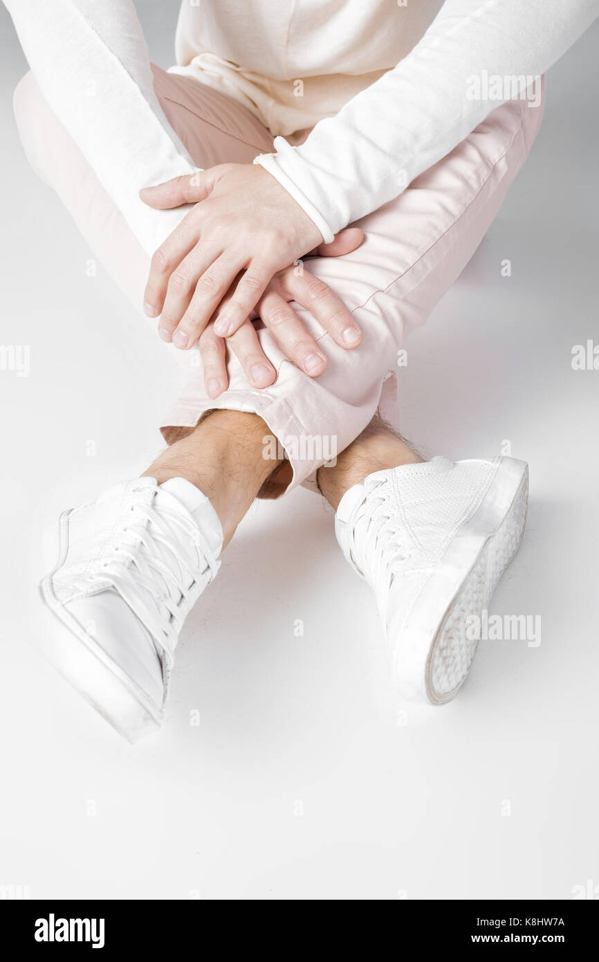 male legs in white sneakers Stock Photo - Alamy
