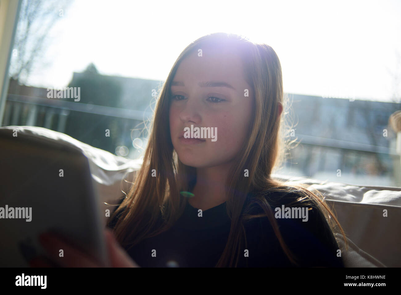 Teenage girl using computer at home hi-res stock photography and images ...