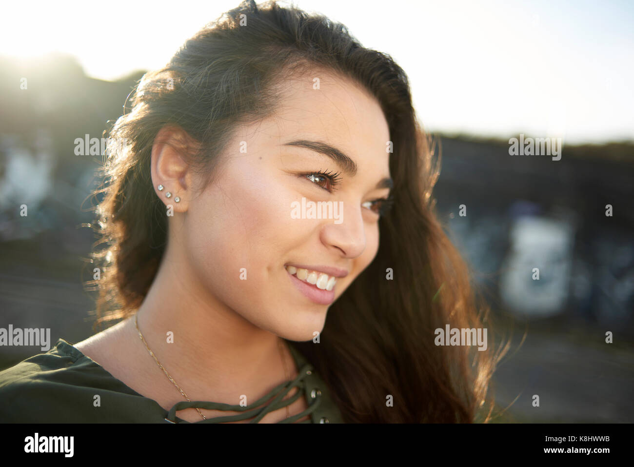 Close-up of happy teenage girl looking away Stock Photo - Alamy