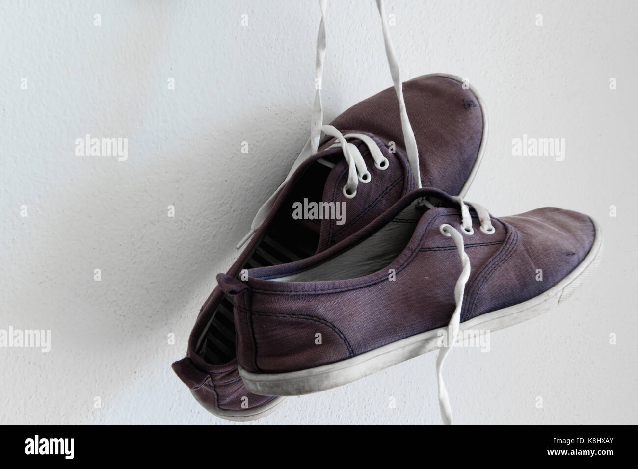 Sneakers hanging on wall hi-res stock photography and images - Alamy