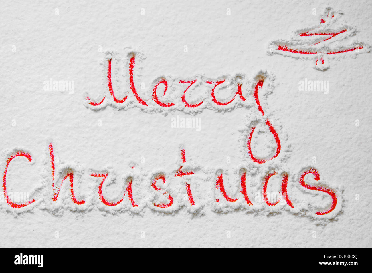Text "Merry Christmas" on the snow Stock Photo - Alamy