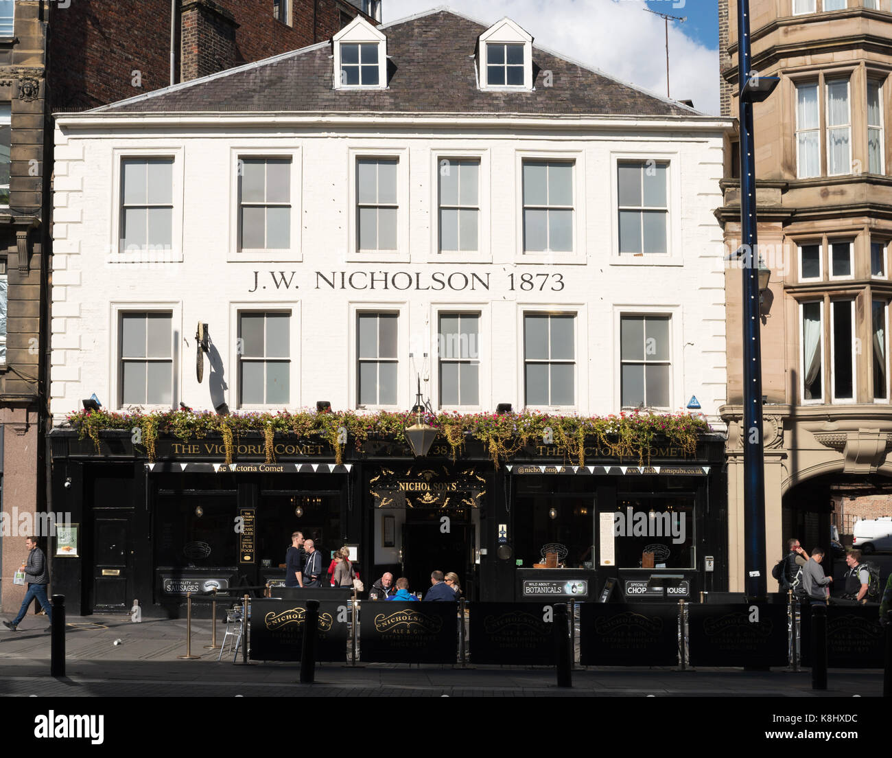 People sat outside The Victoria Comet, J. W. Nicholson pub, Neville St ...