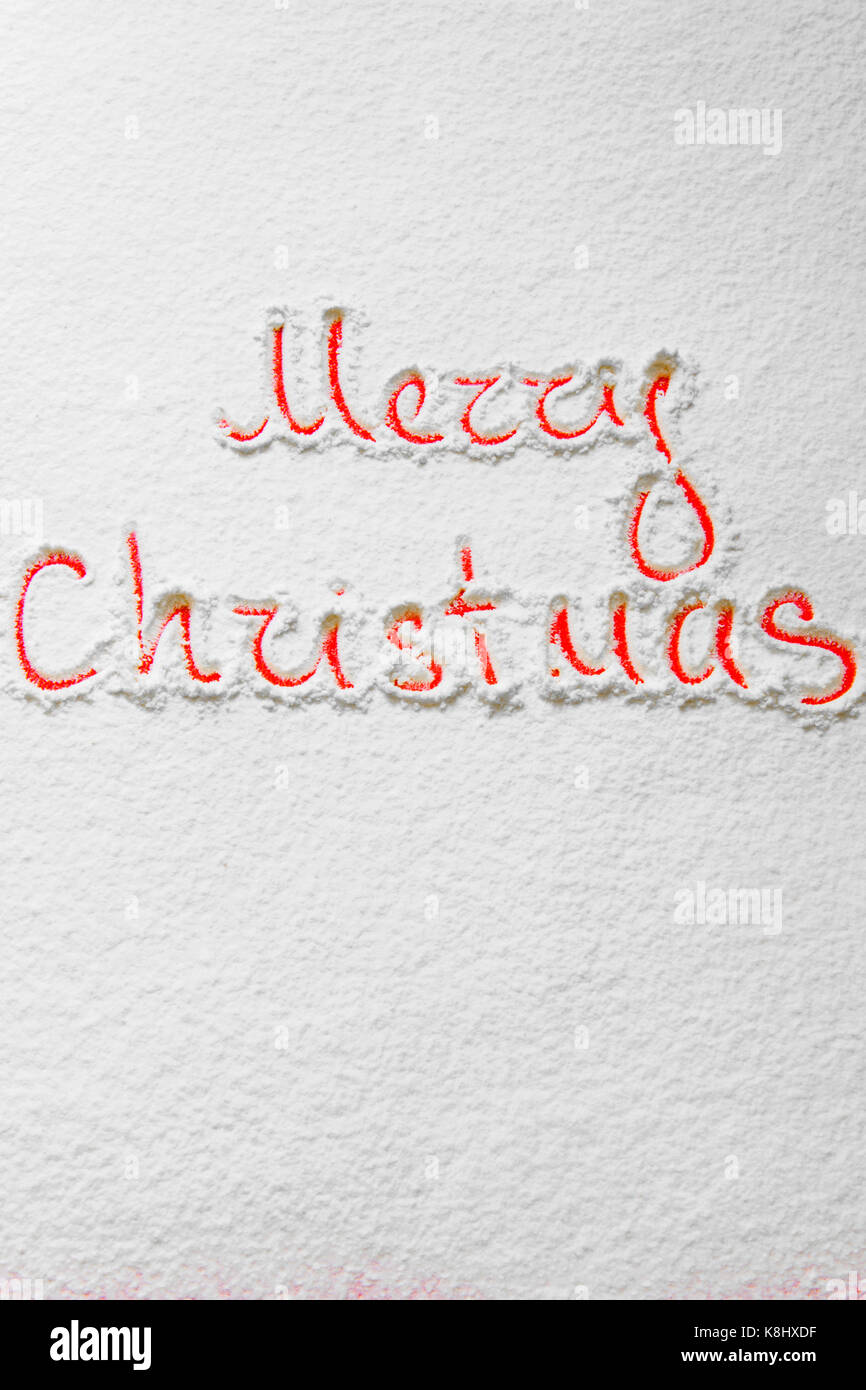 Text "Merry Christmas" on the snow Stock Photo - Alamy