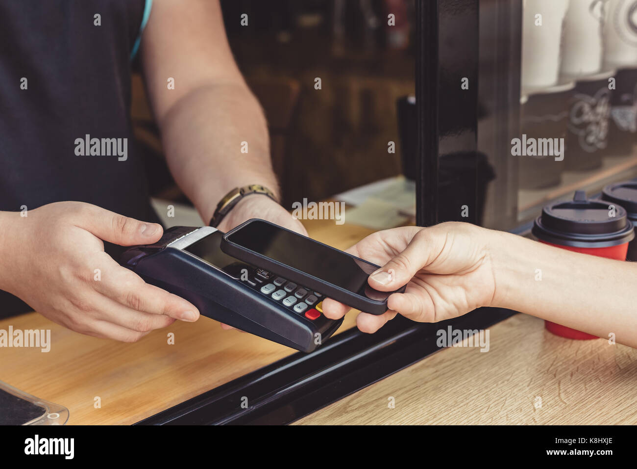 Woman paying bill through hi-res stock photography and images - Alamy