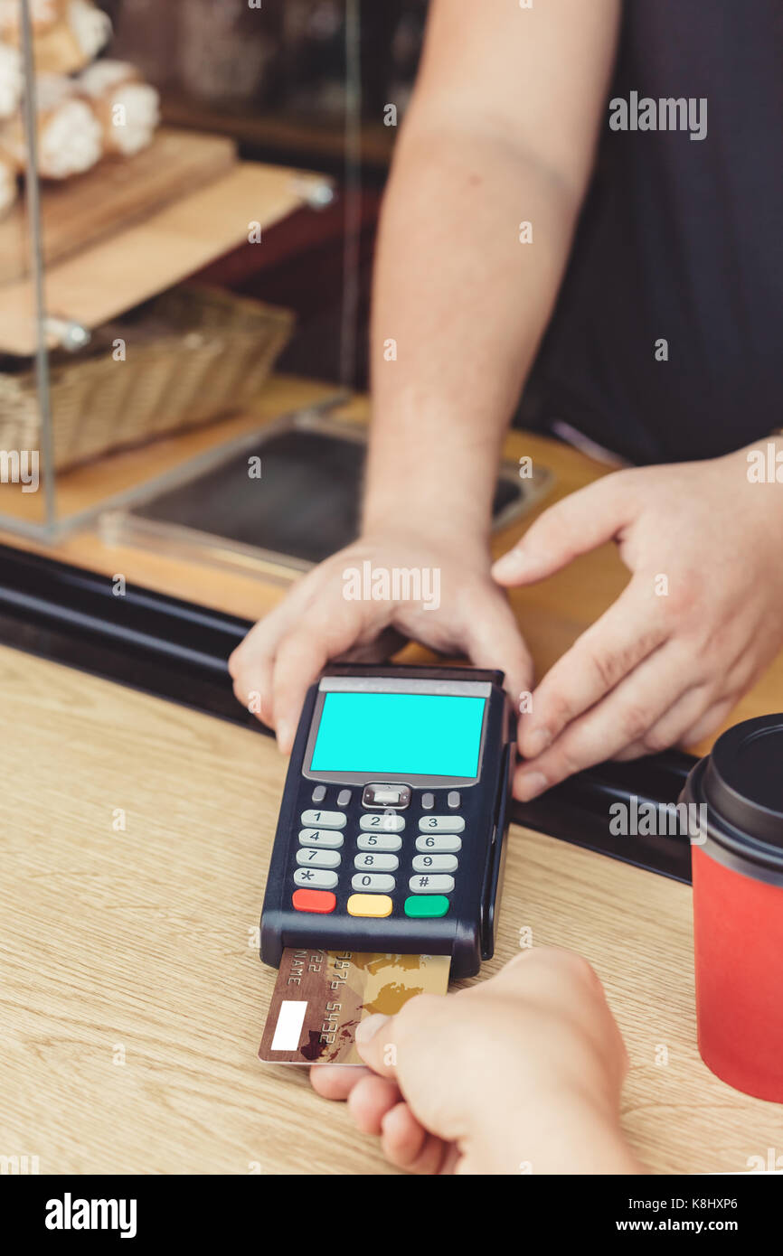 Person paying bill in cafe Stock Photo - Alamy