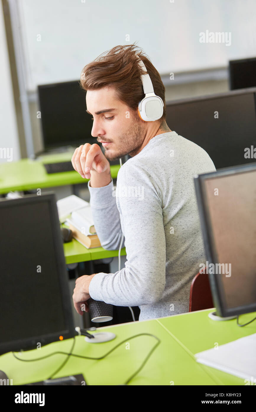Student in computer course thinking with concentration Stock Photo - Alamy
