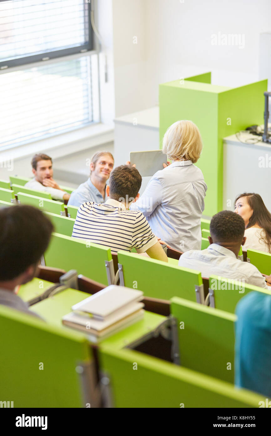 Students and teacher in universtiy in lecture hall Stock Photo - Alamy