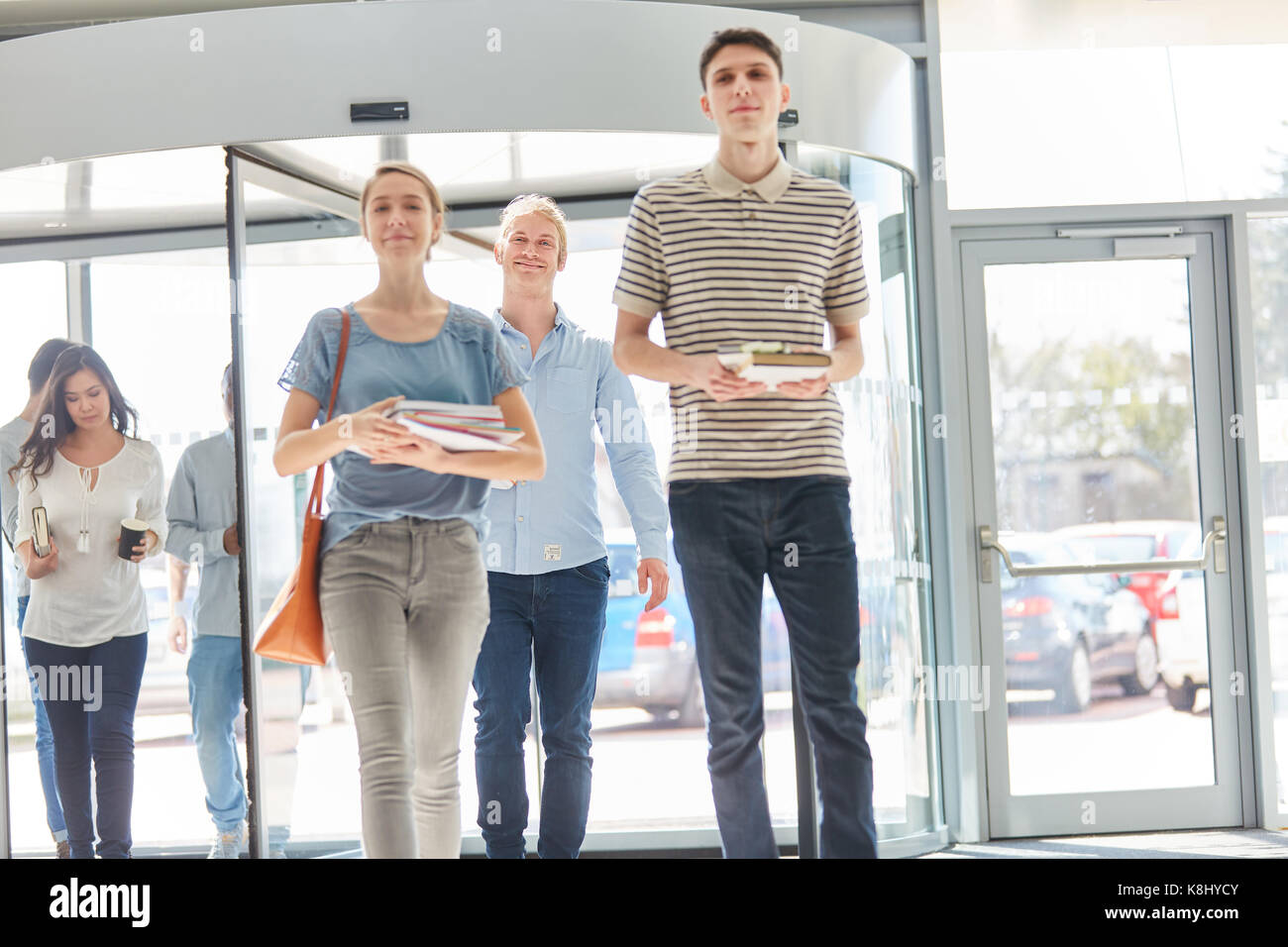 Students in university entrance walk together as freshman Stock Photo ...