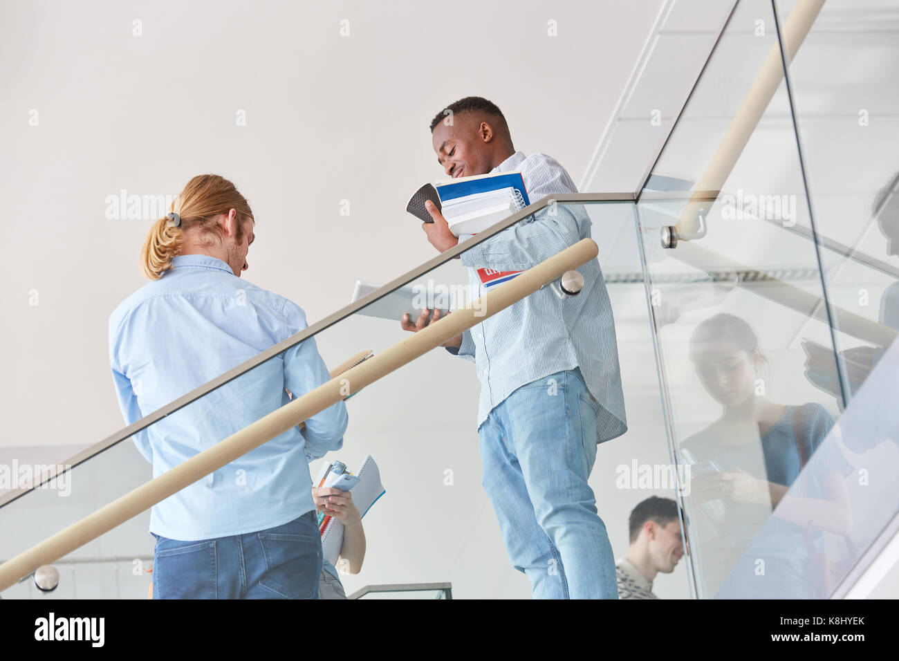 Group of students in class break at university stairs Stock Photo - Alamy