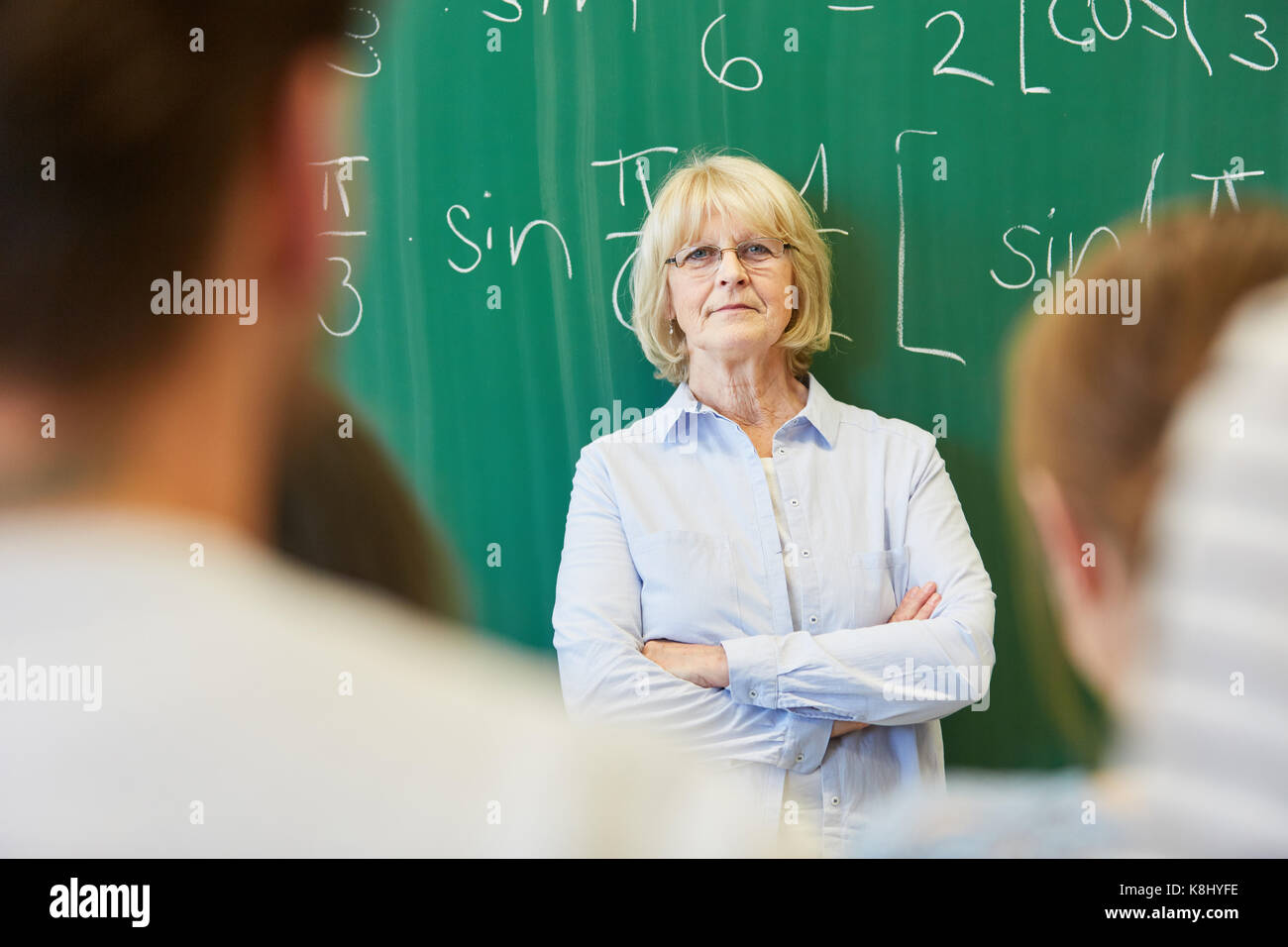 Senior woman as lecturer with authority and competence Stock Photo - Alamy