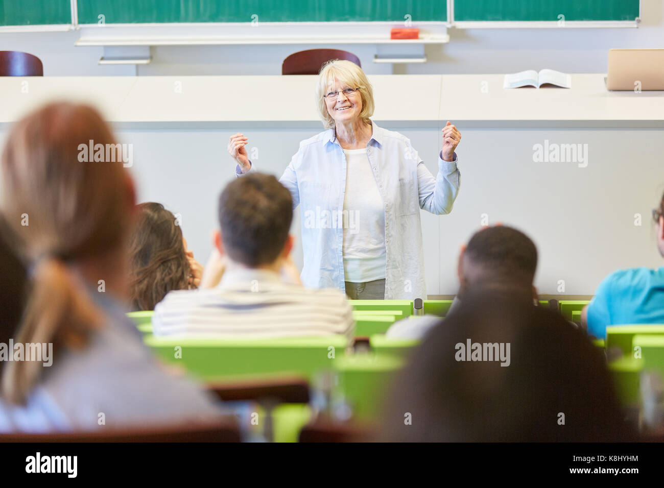 Woman as teacher in school seminar at lecture hall Stock Photo - Alamy