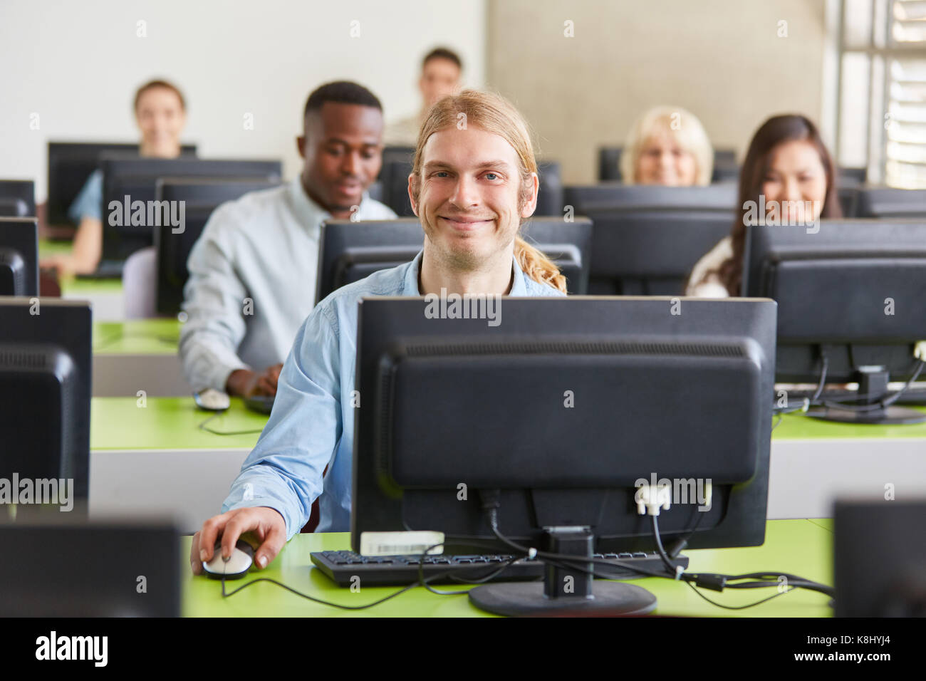 Students in computer seminar in IT training class Stock Photo - Alamy