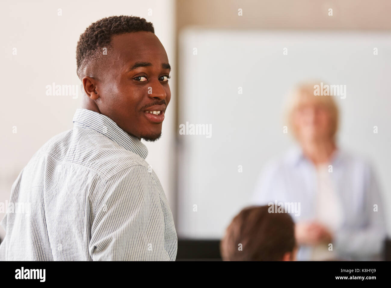 African student in class answers teacher question Stock Photo - Alamy
