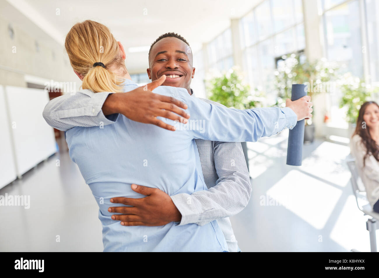 Students congratulate each other after university diploma completion ...