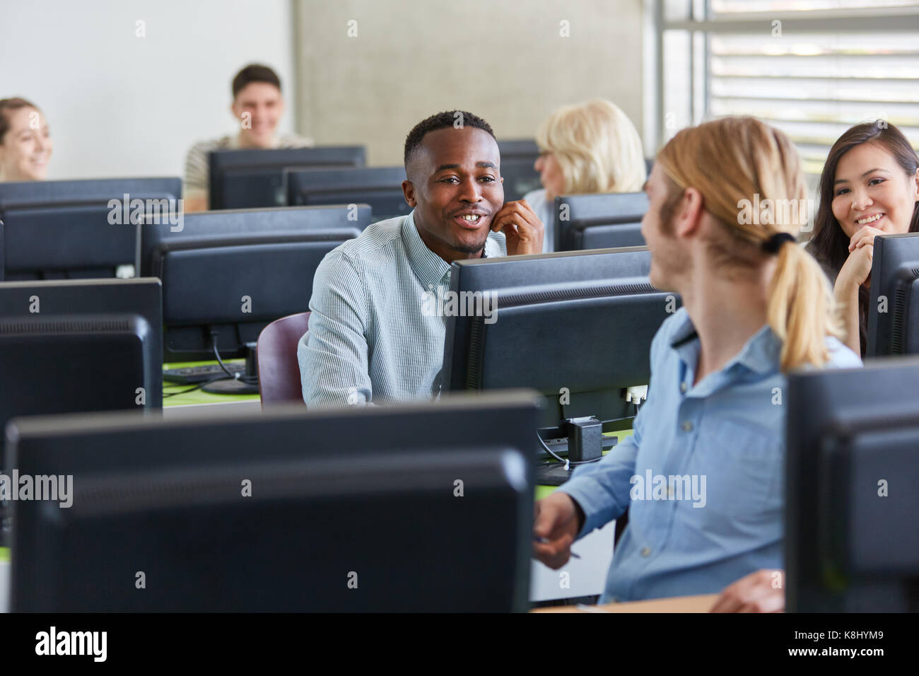 Integrated african student at computer course in university seminar ...