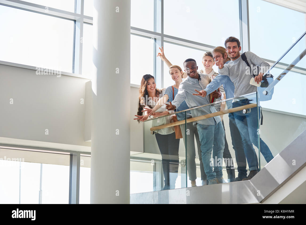 Students team celebrates passed exam in university staircase Stock ...