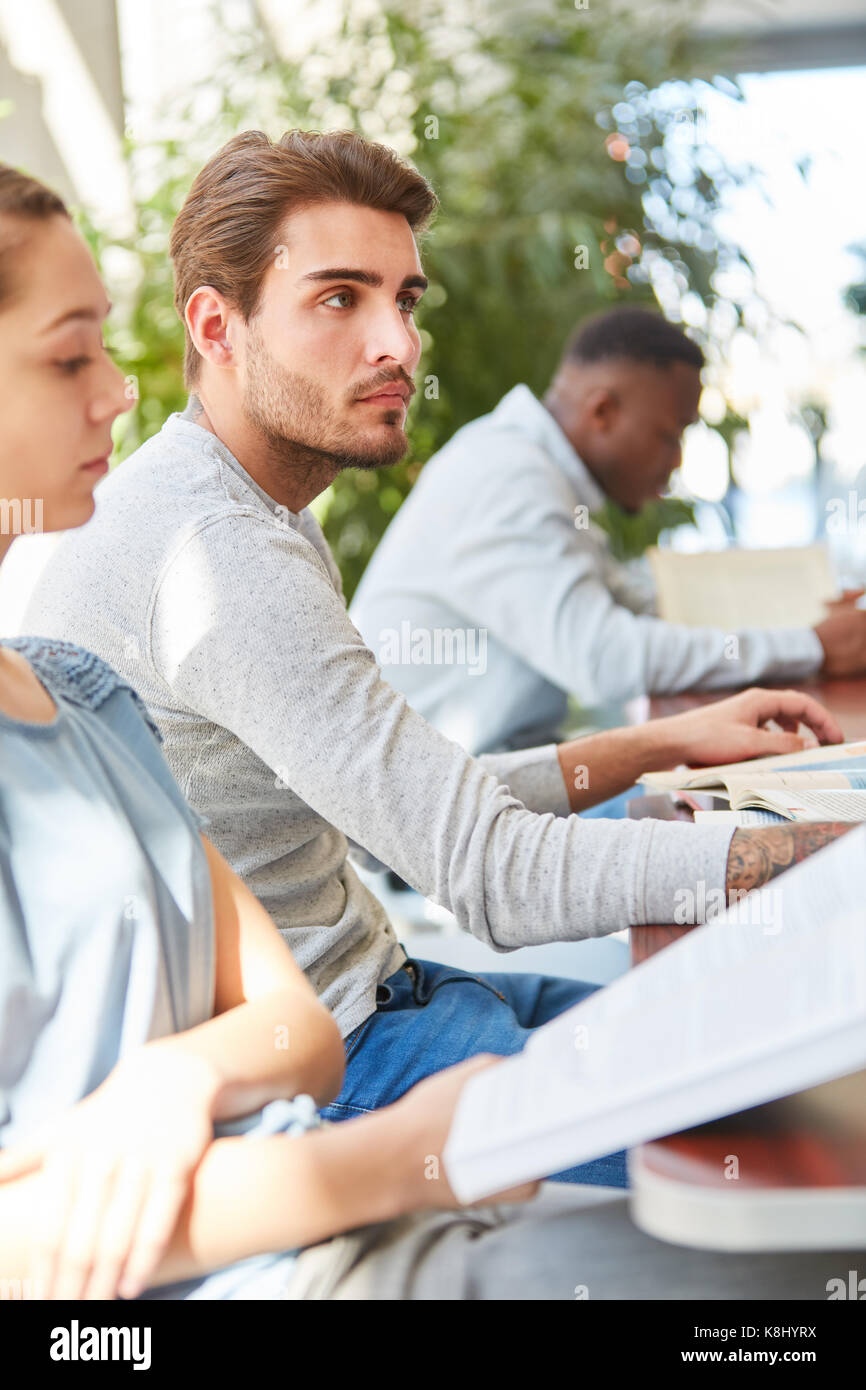 Young student study with team in cooperation as a group Stock Photo - Alamy
