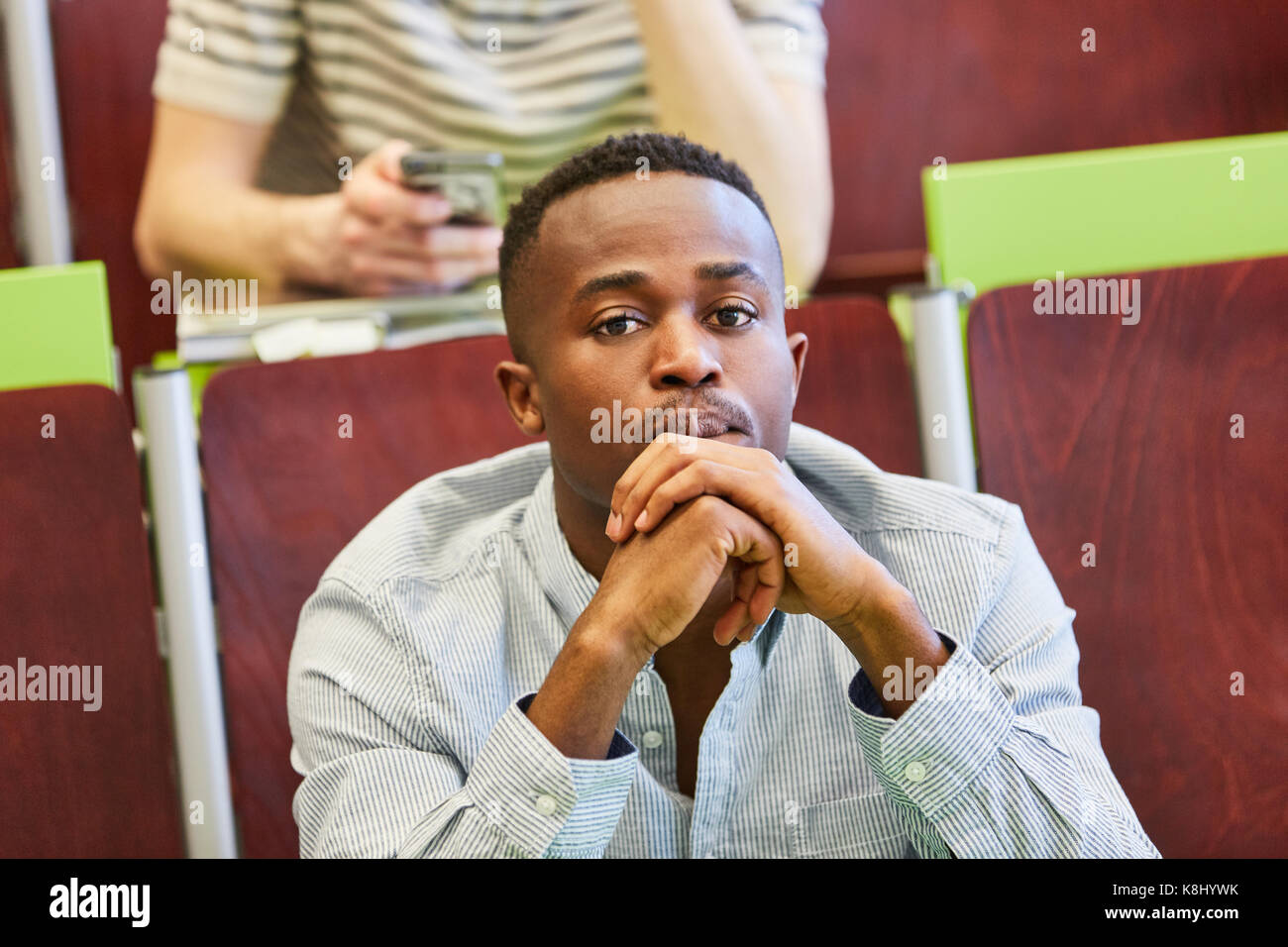 African man as student in university lecture learns with diligence ...