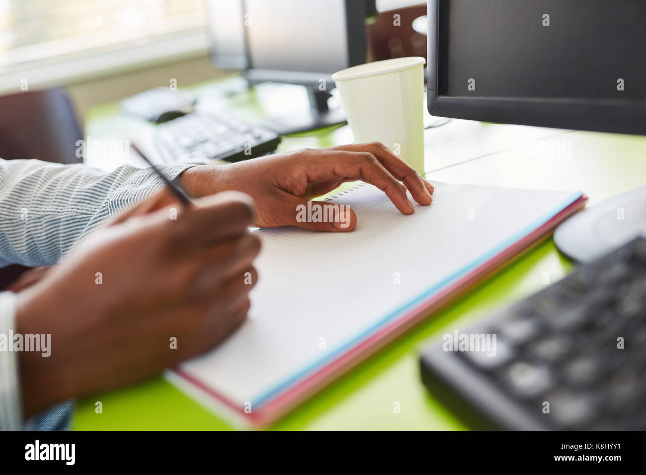 Student presenting test in university and writing Stock Photo - Alamy