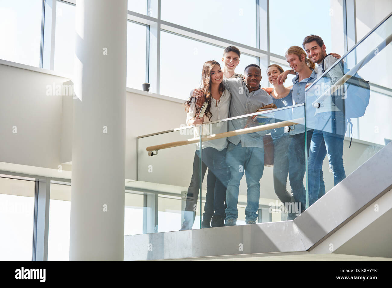 Students standing together as successful and interracial team Stock ...