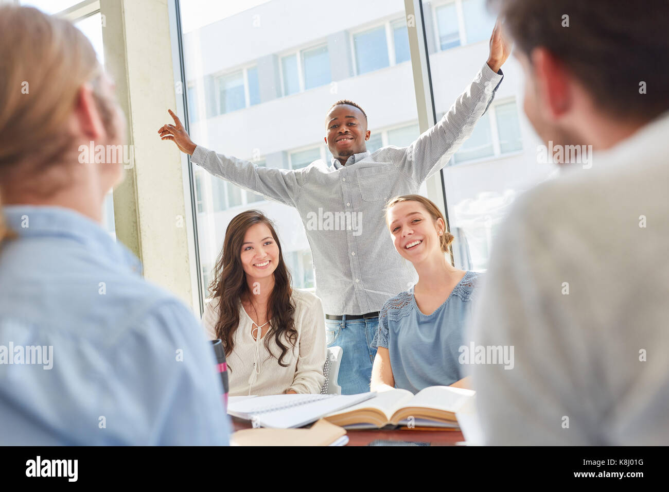 Happy students celebrate exam results together Stock Photo - Alamy