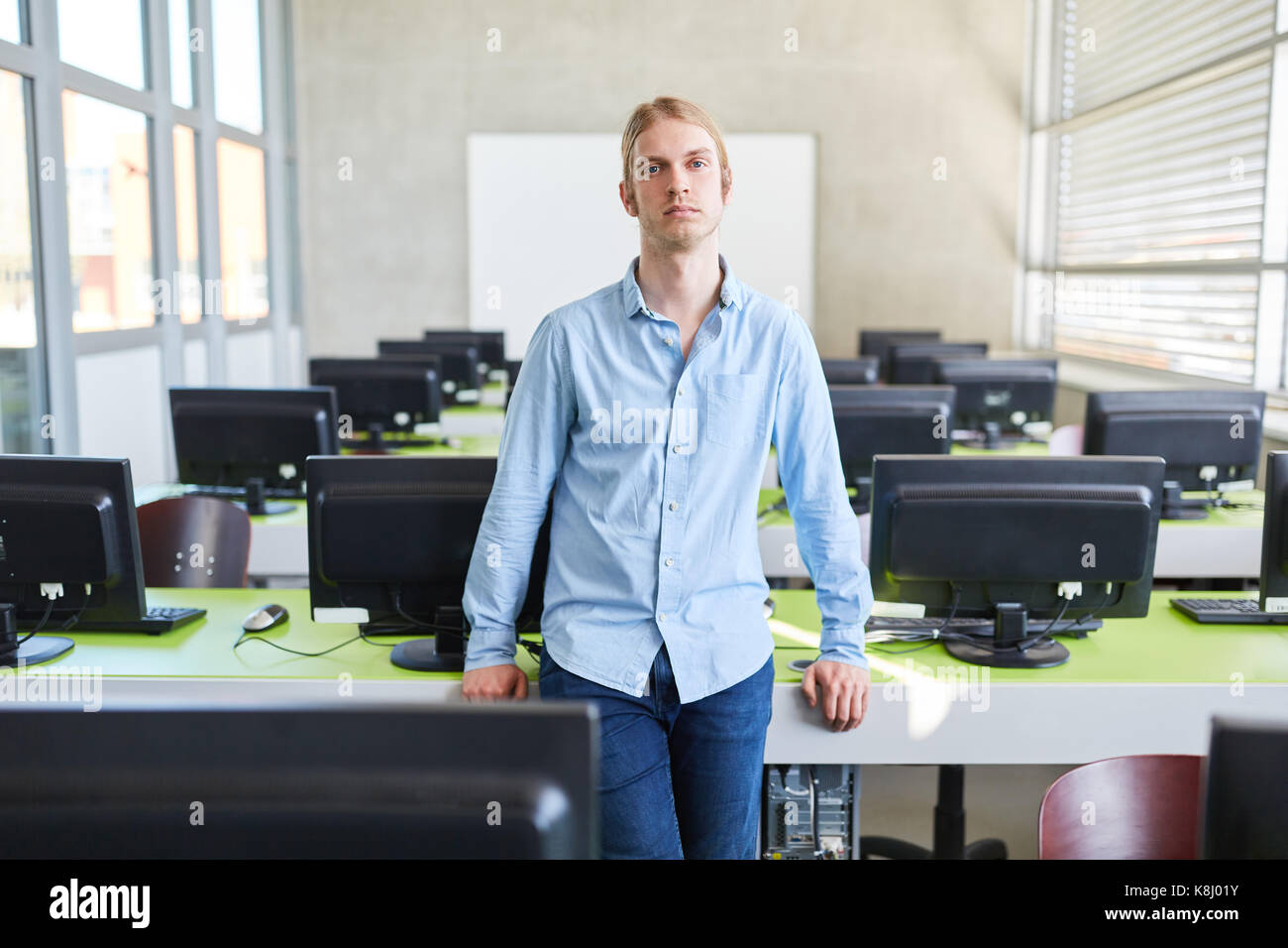 Young man as IT programmer in computer course at university Stock Photo ...