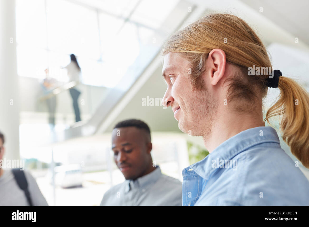 Interracial group of friends stand together as school students Stock ...