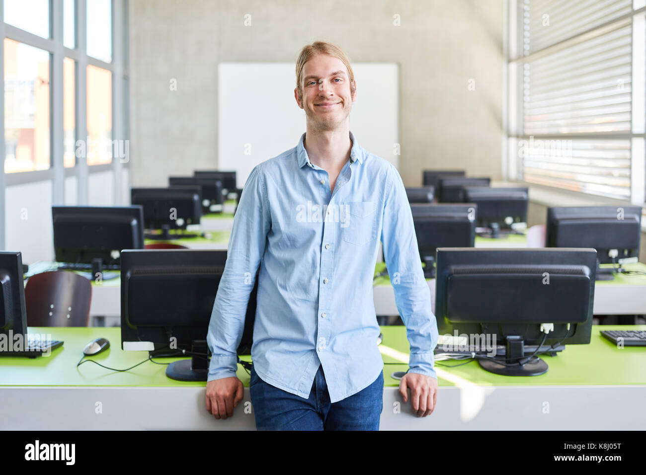 IT student in computer science course smiles happy Stock Photo - Alamy