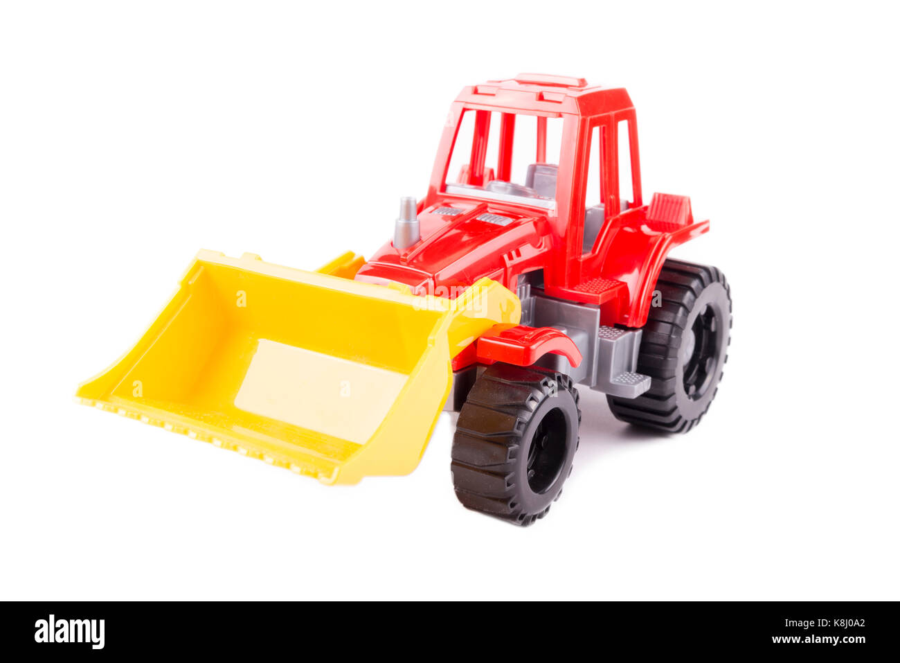 red toy tractor on a white background Stock Photo - Alamy