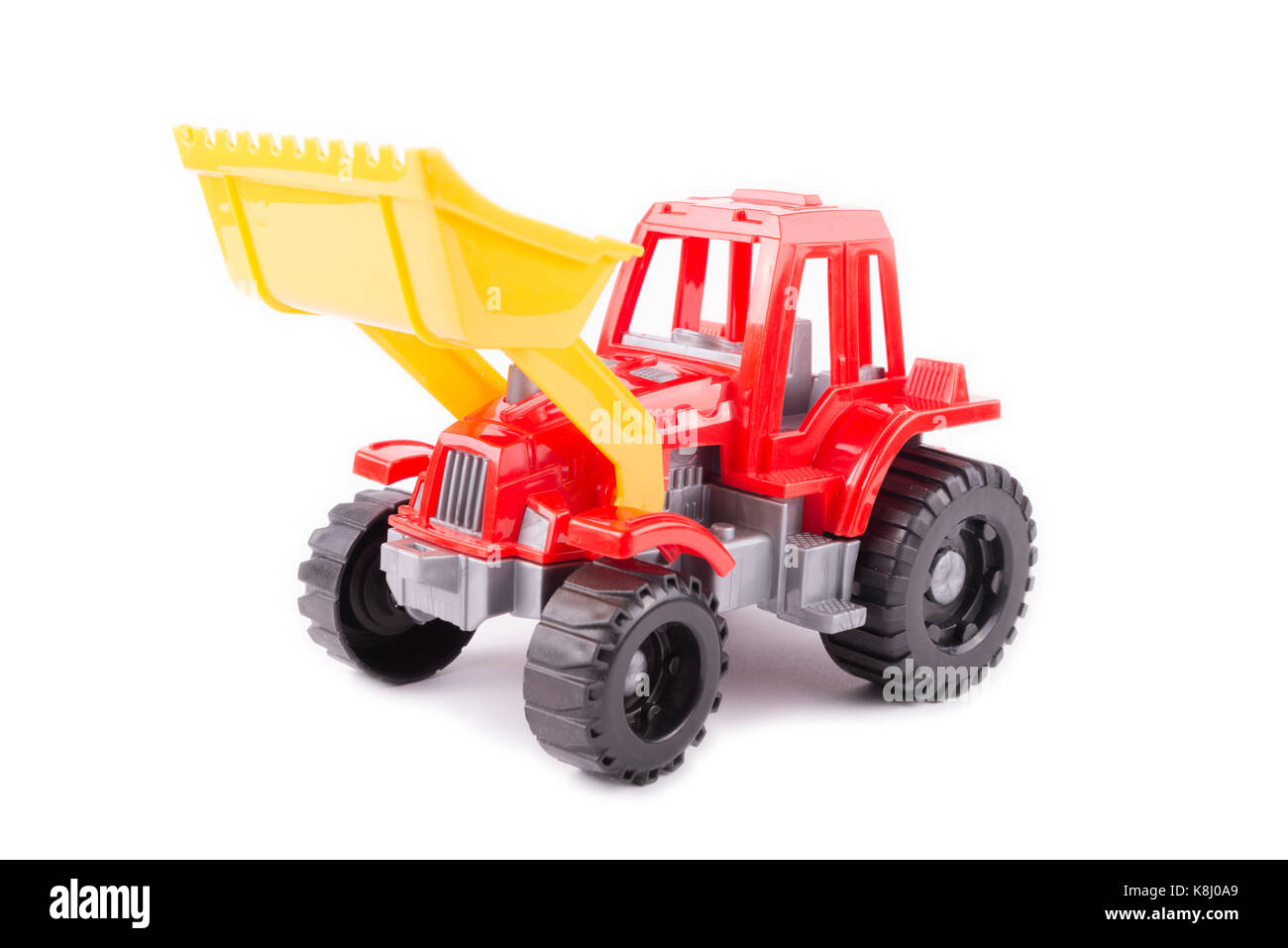 red toy tractor on a white background Stock Photo - Alamy